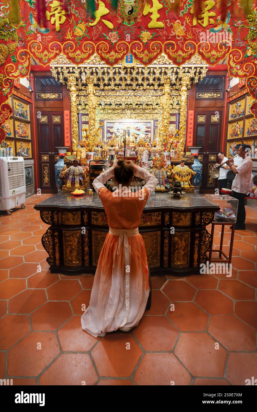 Georgetown, Penang, Malaysia - 17 February 2024: Woman praying at Chau ...