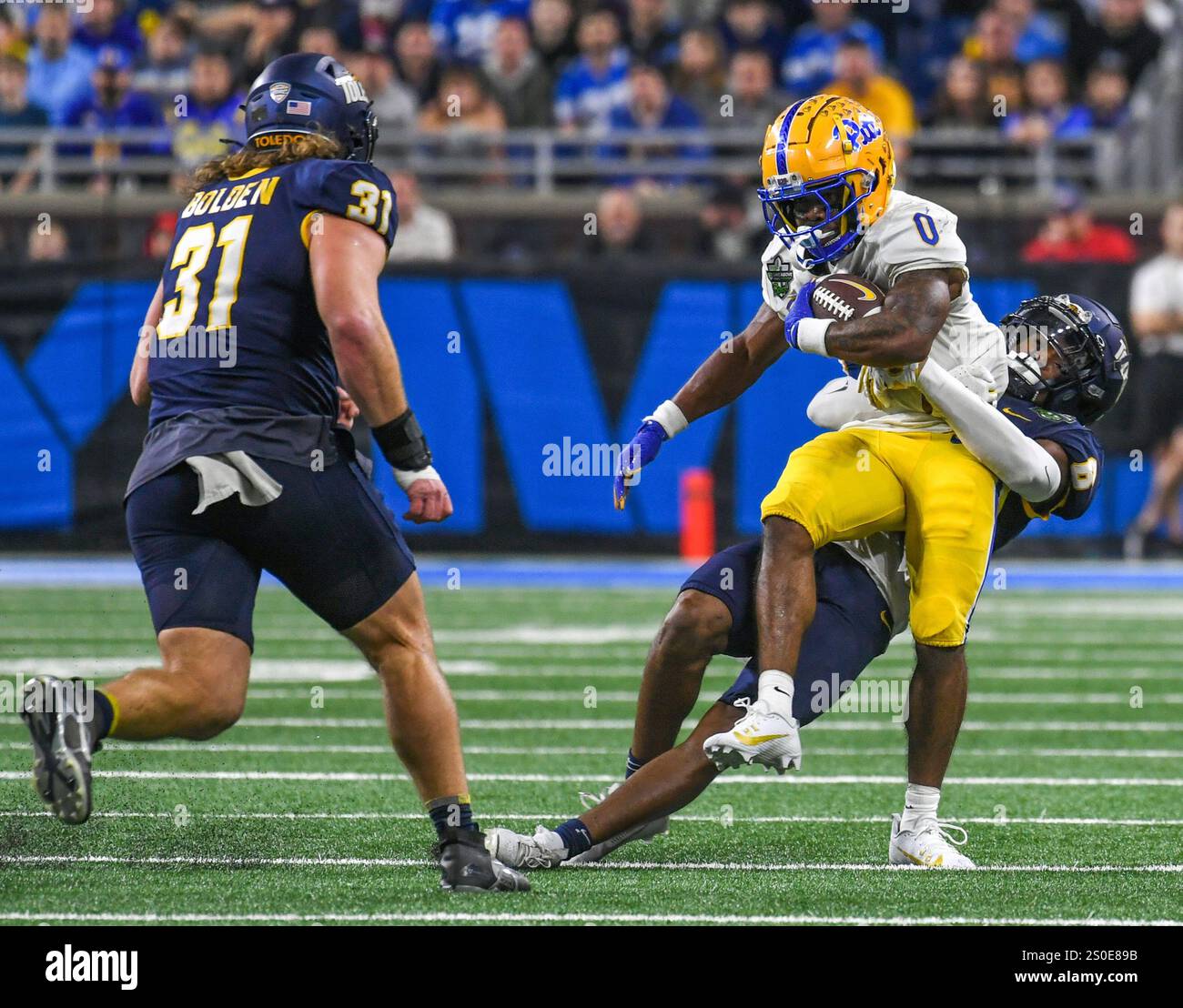 December 26, 2024: Pitt running back Desmond Reid (0) gets tackled by ...