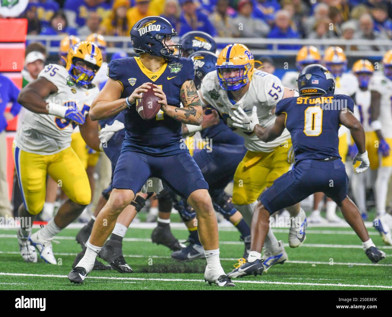 Detroit. 26th Dec, 2024. Toledo QB Tucker Gleason drops back to pass ...
