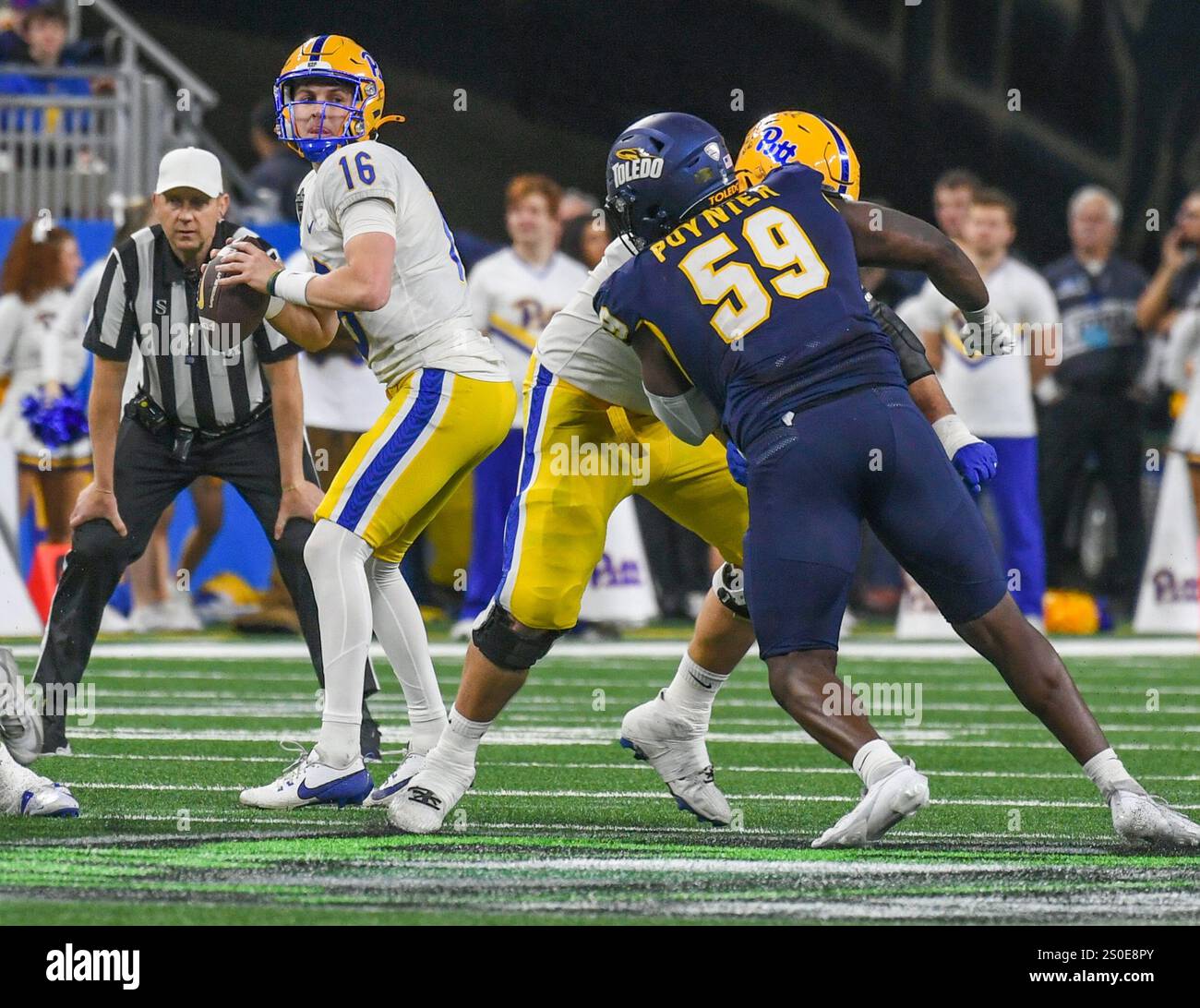 Detroit. 26th Dec, 2024. Pitt QB David Lynch (16) drops back to pass ...