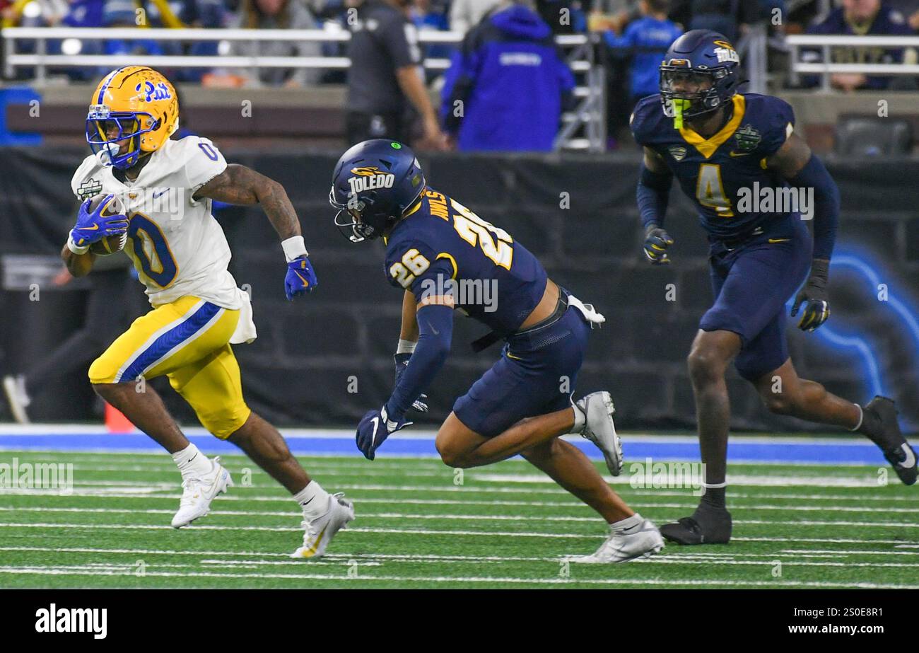Detroit. 26th Dec, 2024. Toledo Safety Braden Awls (26) pursues Pitt RB ...