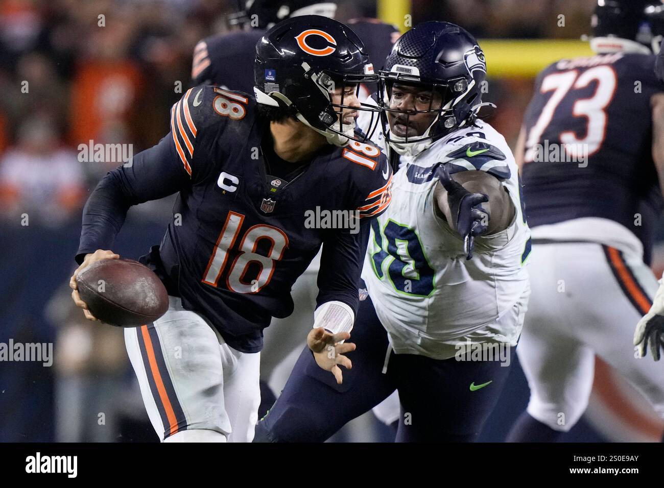 Chicago Bears quarterback Caleb Williams (18) runs with the ball ...