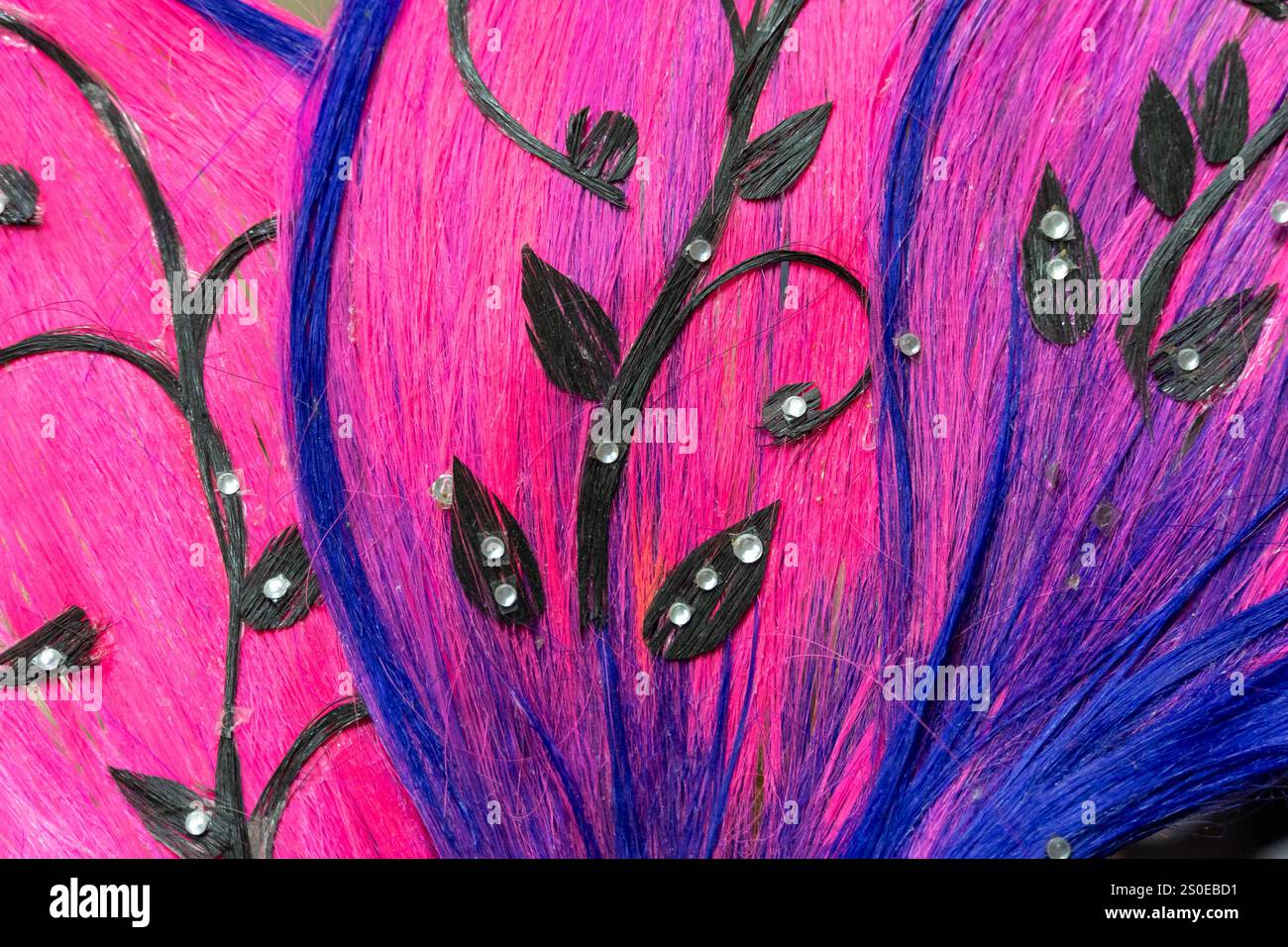 Colorful strands decorated with floral motifs and beads showcase ...