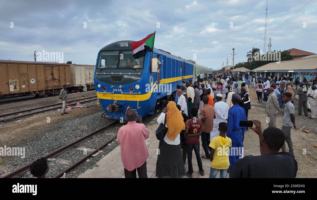 Port Sudan, Sudan. 27th Dec, 2024. People gather on the platform of a ...