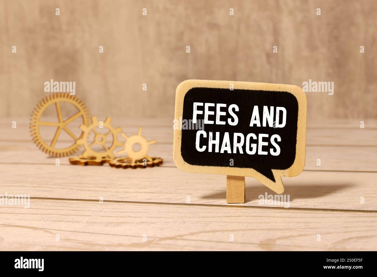 Fees and charges message written on ripped torn paper with blue ...