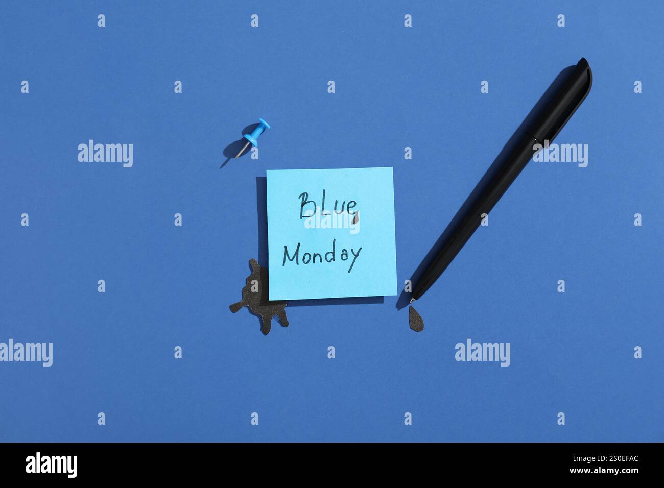 Paper sheet with written text BLUE MONDAY, pen and blot Stock Photo - Alamy