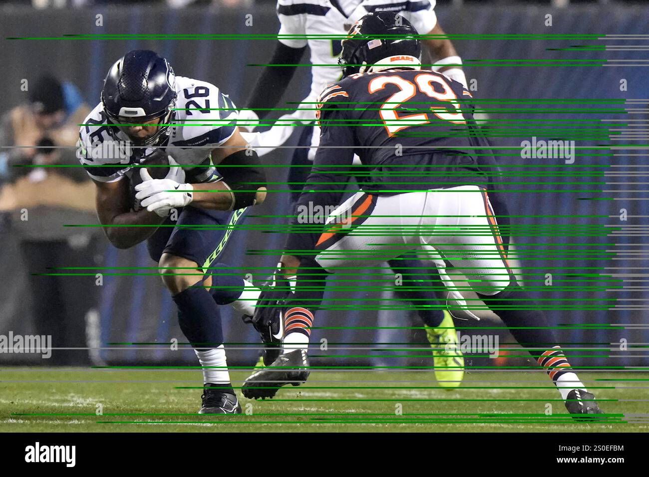 Seattle Seahawks running back Zach Charbonnet (26) runs against Chicago ...
