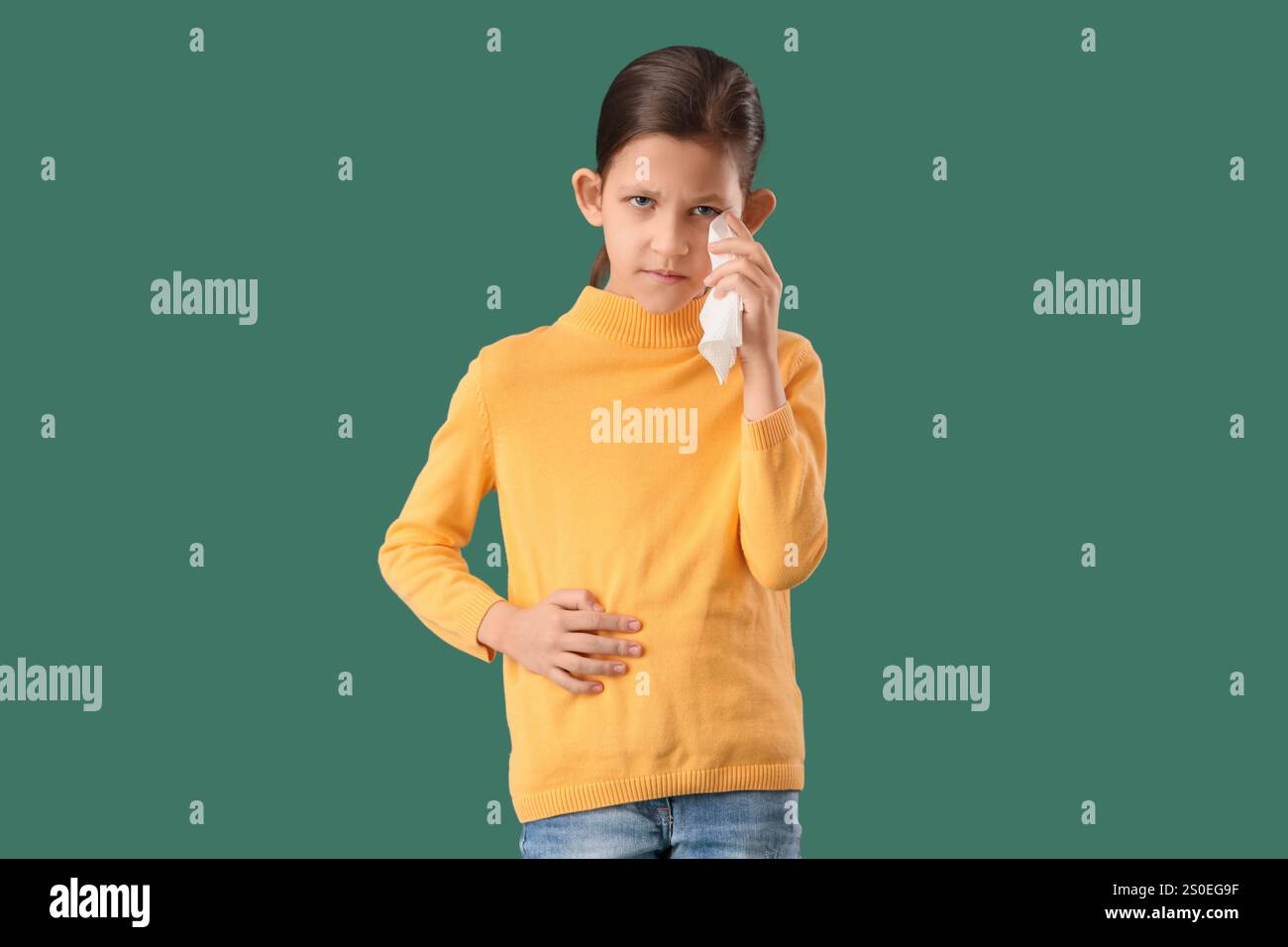 Teenage girl with appendicitis crying on green background Stock Photo ...