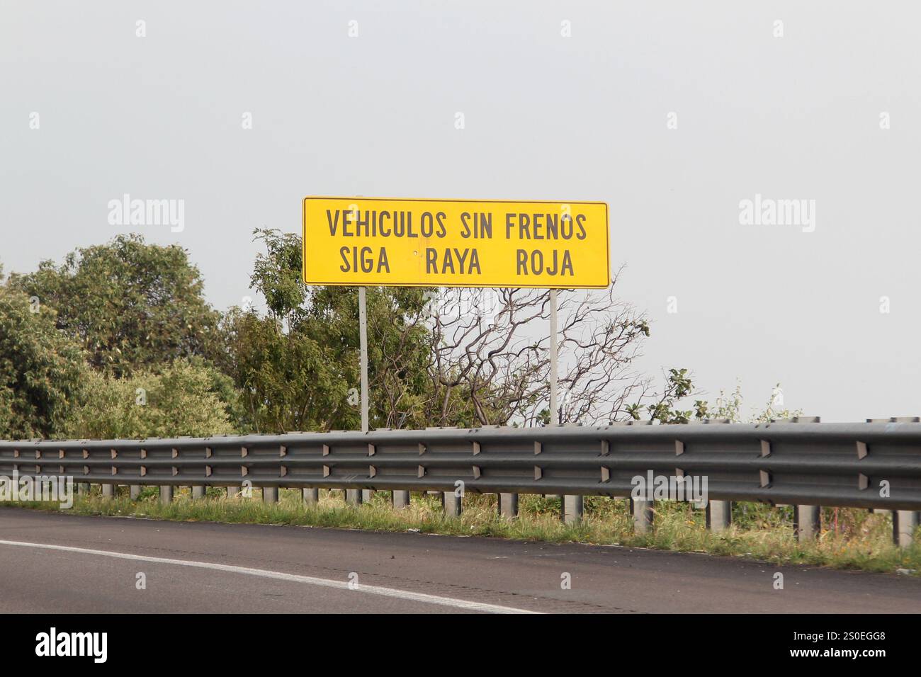 Sign on the highway to indicate a braking ramp to stop vehicles that ...