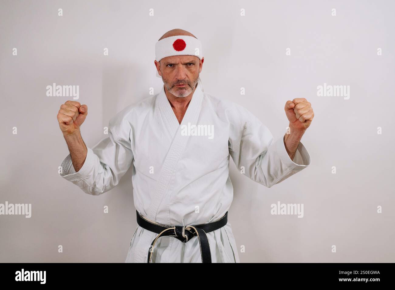 Serious karate sensei in a karate gi Stock Photo - Alamy