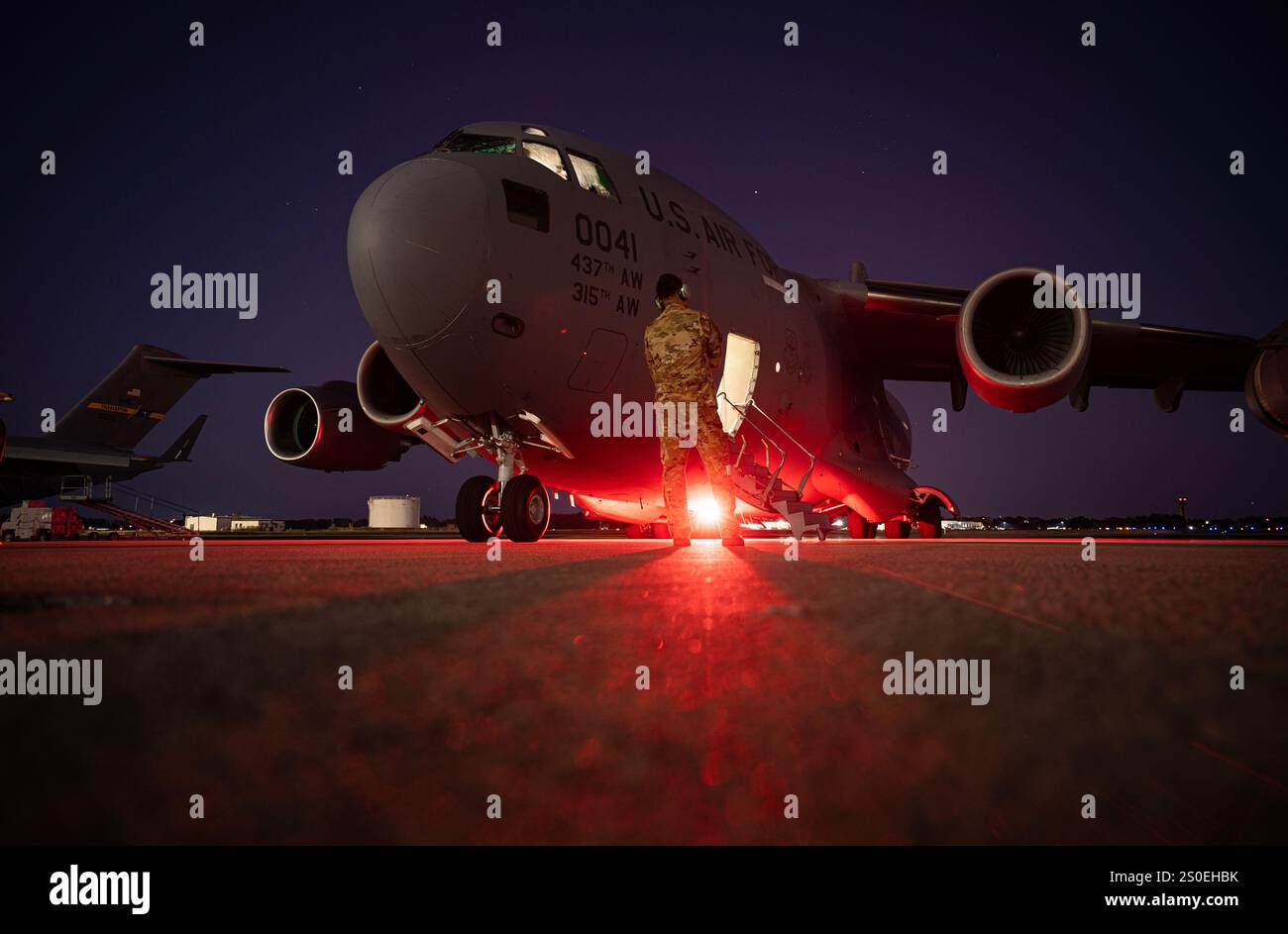 U.S. Air Force Airman 1st Class Joshua De Leon, 14th Airlift Squadron loadmaster, stands outside ...