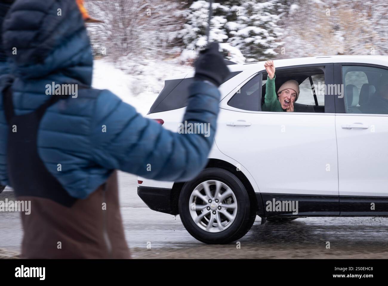 Snydervilled, Utah, USA. 27th Dec, 2024. A woman shouts her support ...