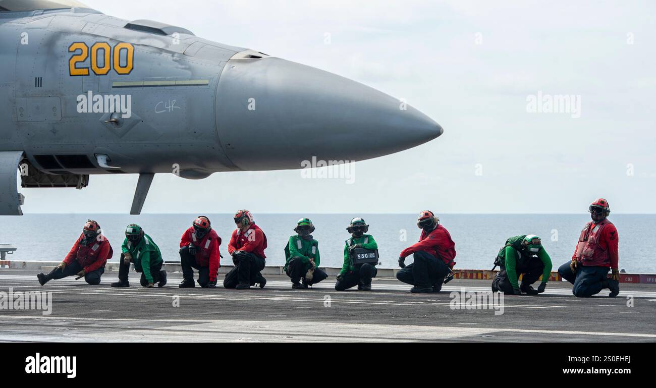 241227-N-FS097-1068 SOUTH CHINA SEA (Dec. 27, 2024) Sailors prepare to ...