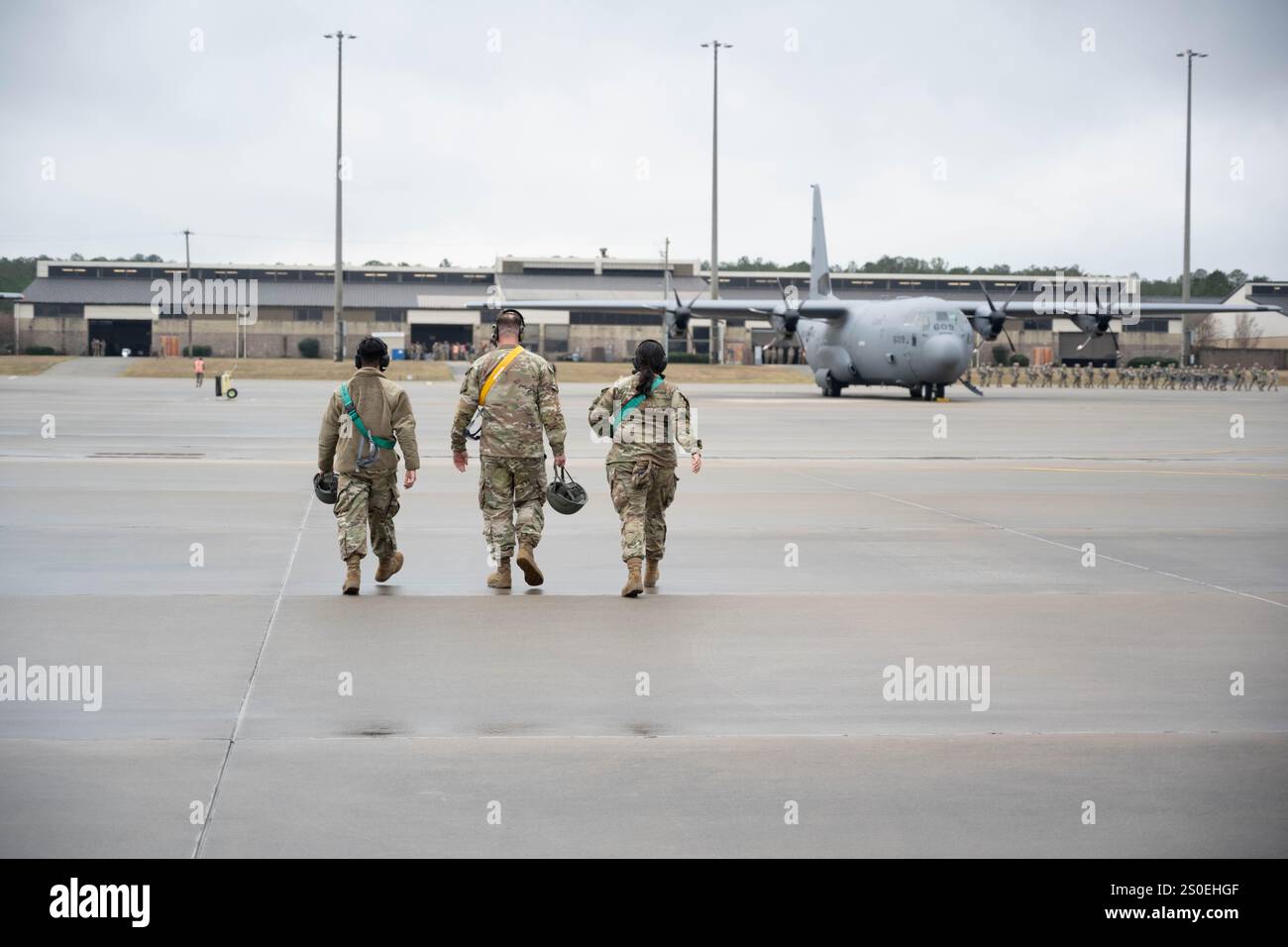 U.S. Airmen from the 43rd Air Mobility Squadron walk back to the ...