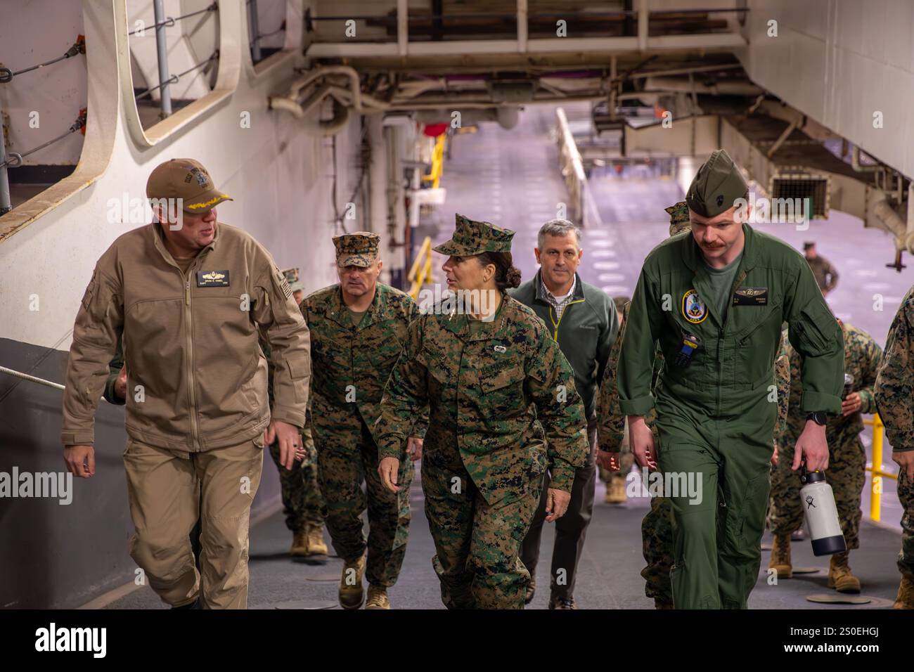 USS Iwo Jima’s (LHD 7) Commanding Officer Capt. Brian Hamel escorts ...