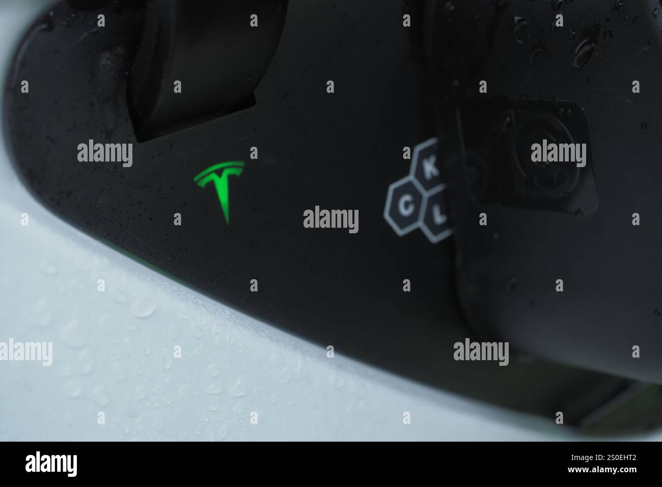 Galati, Romania - December 26, 2024: Tesla charging port connected to a ...