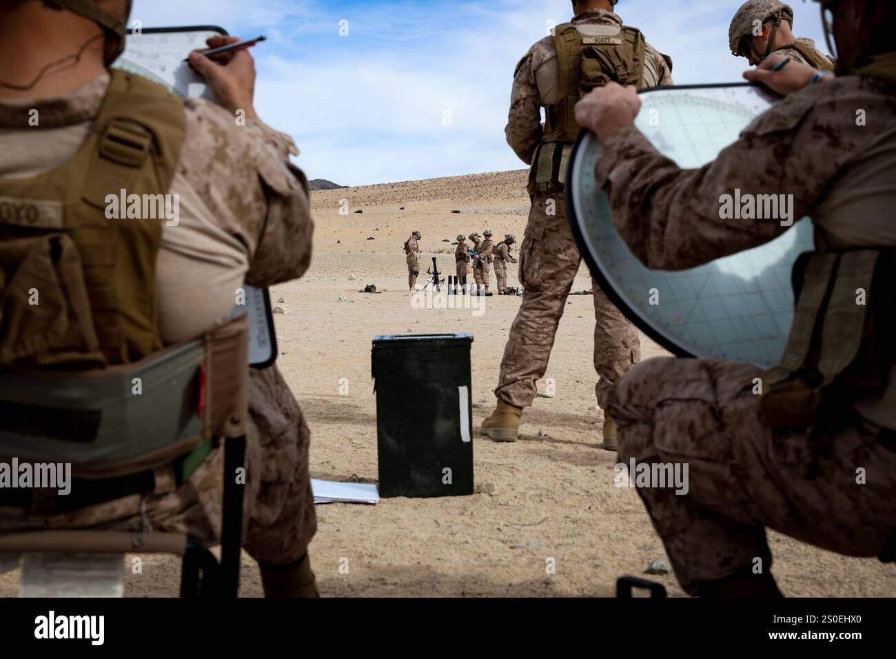 U.S. Marines observe the point of impact for 81 mm mortars during an ...