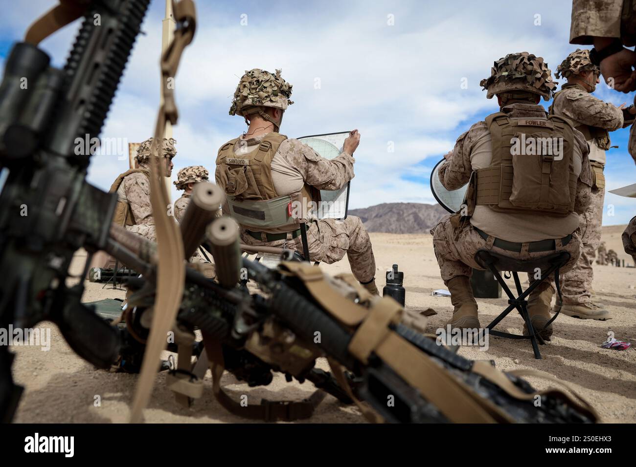 U.S. Marines observe the point of impact for 81 mm mortars during an ...