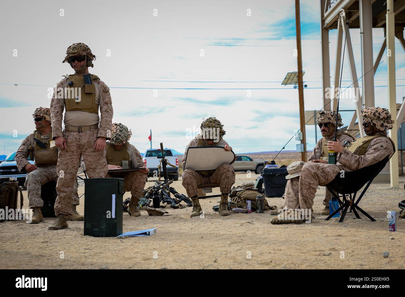 U.S. Marines observe the point of impact for 81 mm mortars during an ...