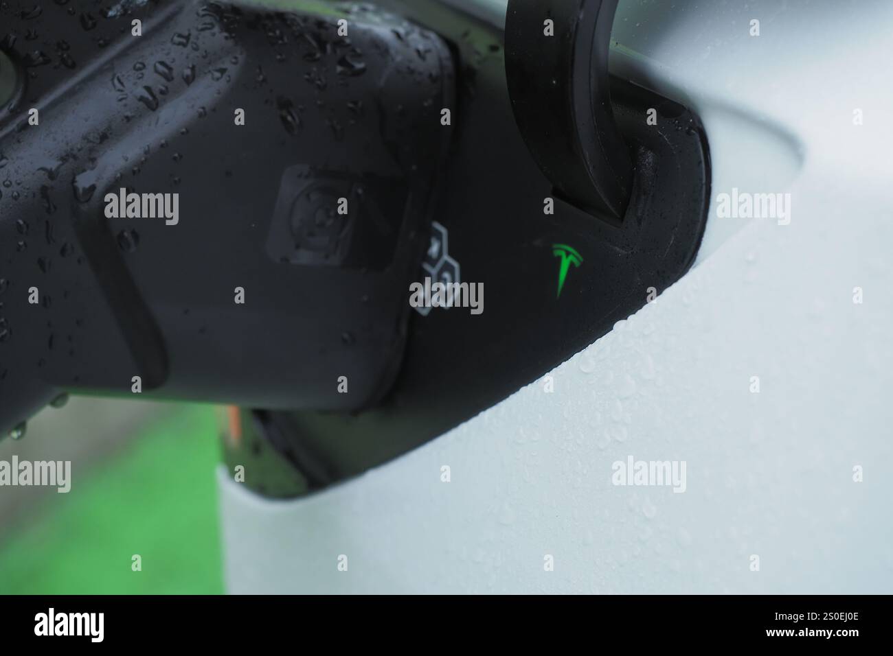 Galati, Romania - December 26, 2024: Tesla charging port connected to a ...