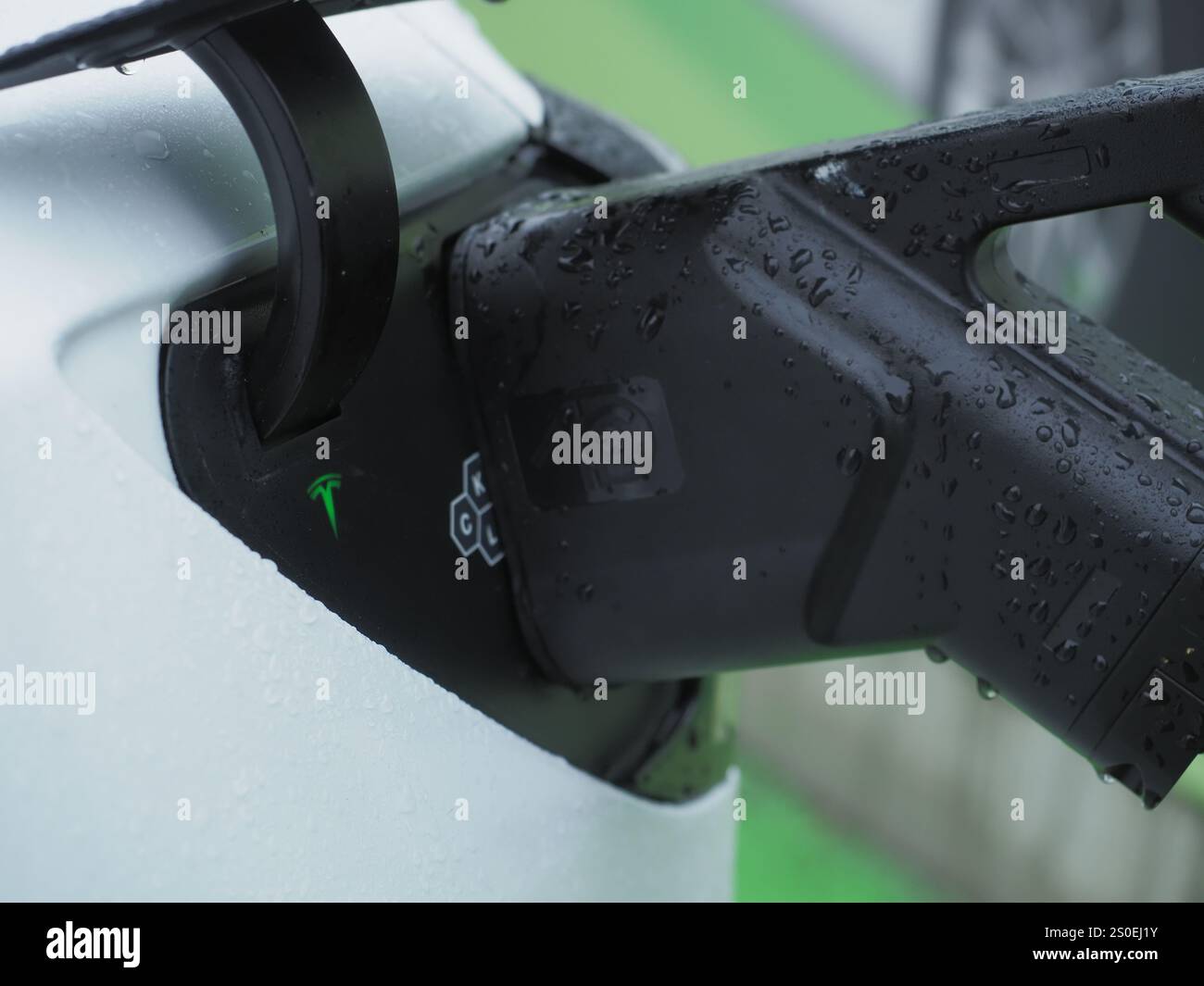 Galati, Romania - December 26, 2024: Tesla charging port connected to a ...