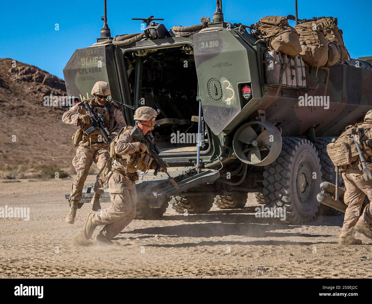 U.S. Marines execute a platoon supported urban raid during an adversary ...
