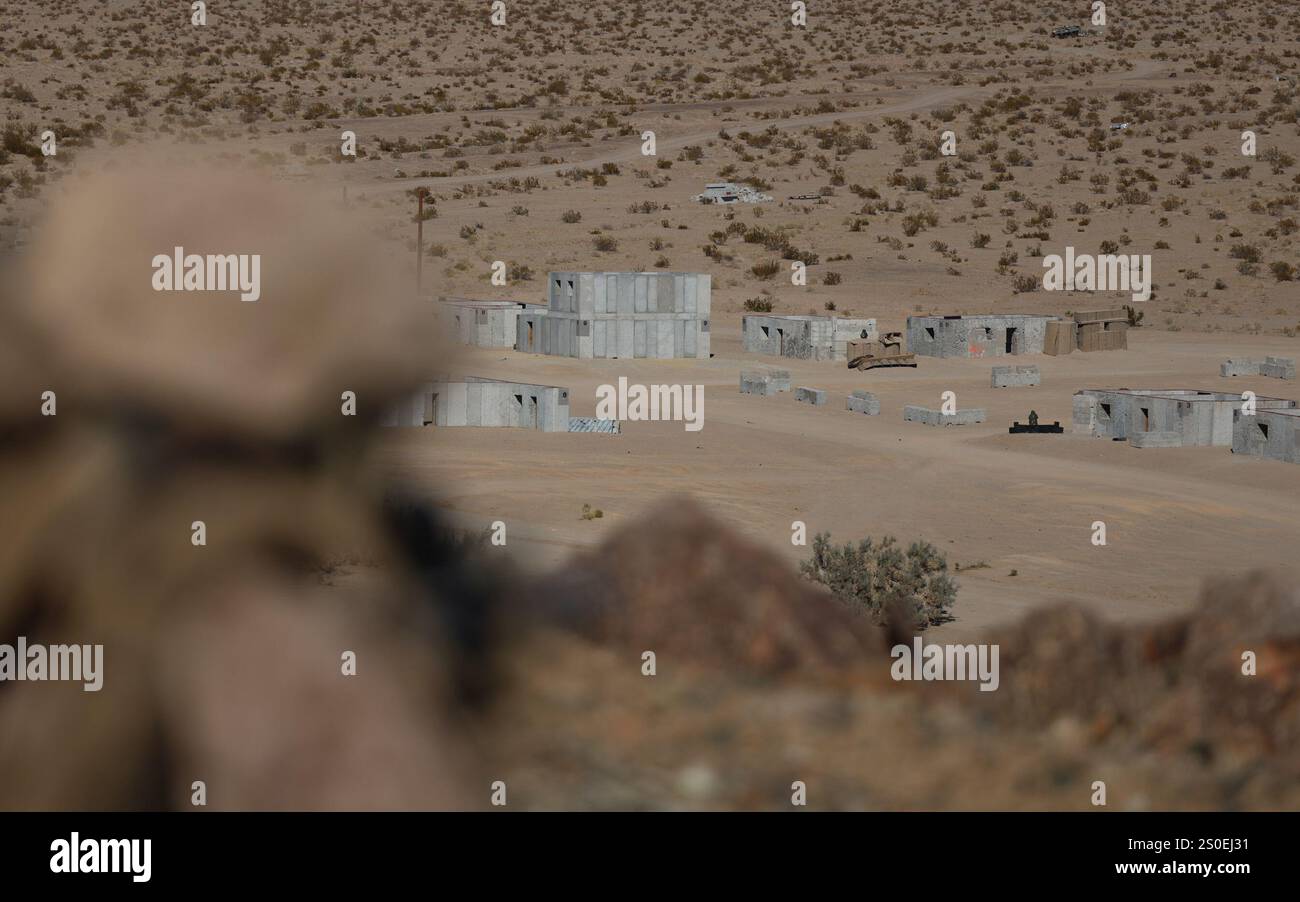 U.S. Marines execute a platoon supported urban raid during an adversary ...