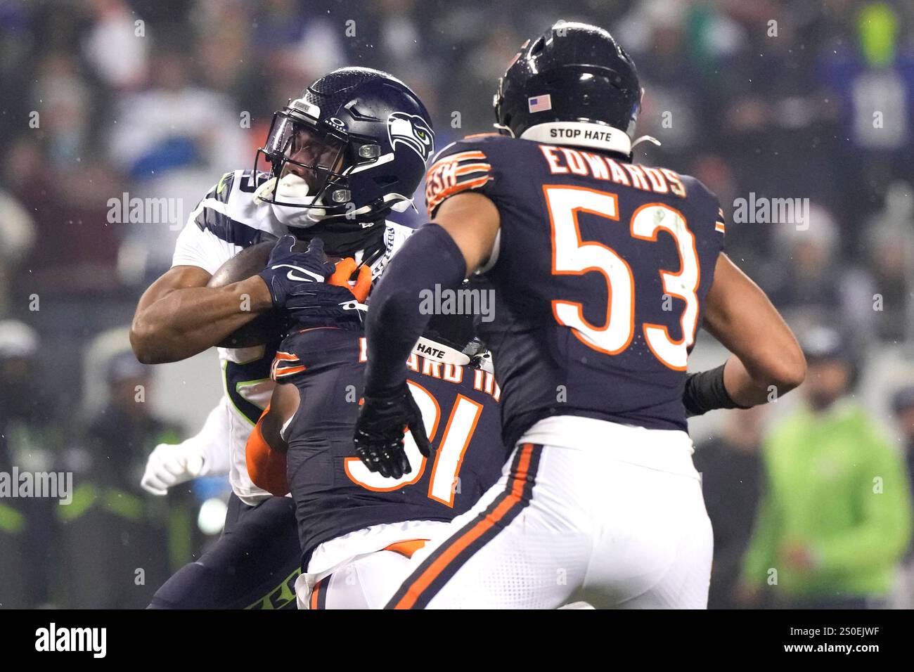 Seattle Seahawks running back Kenny McIntosh (25) is tackled by Chicago ...