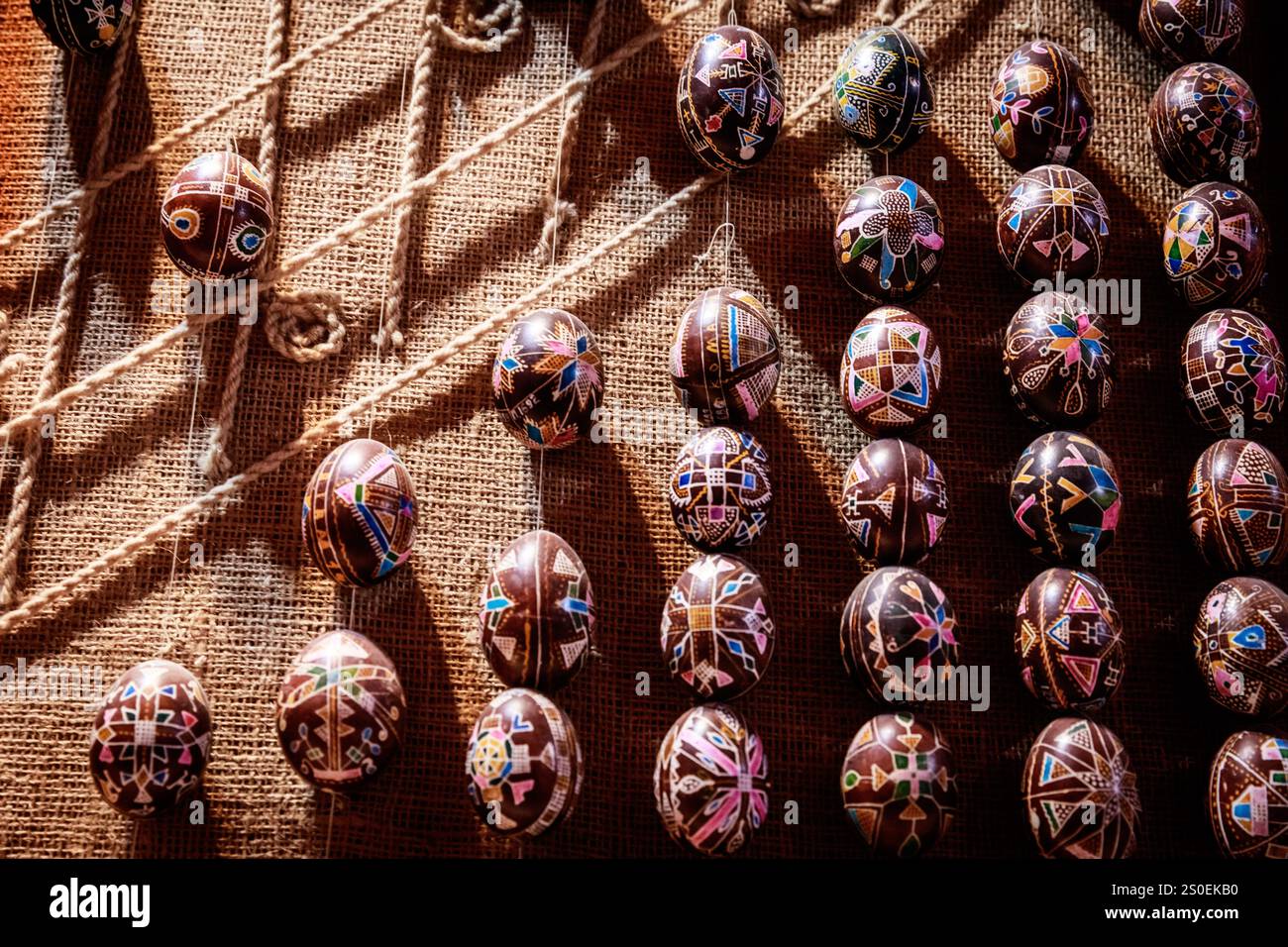 A bunch of colorful beads are arranged in a row. The beads are of ...