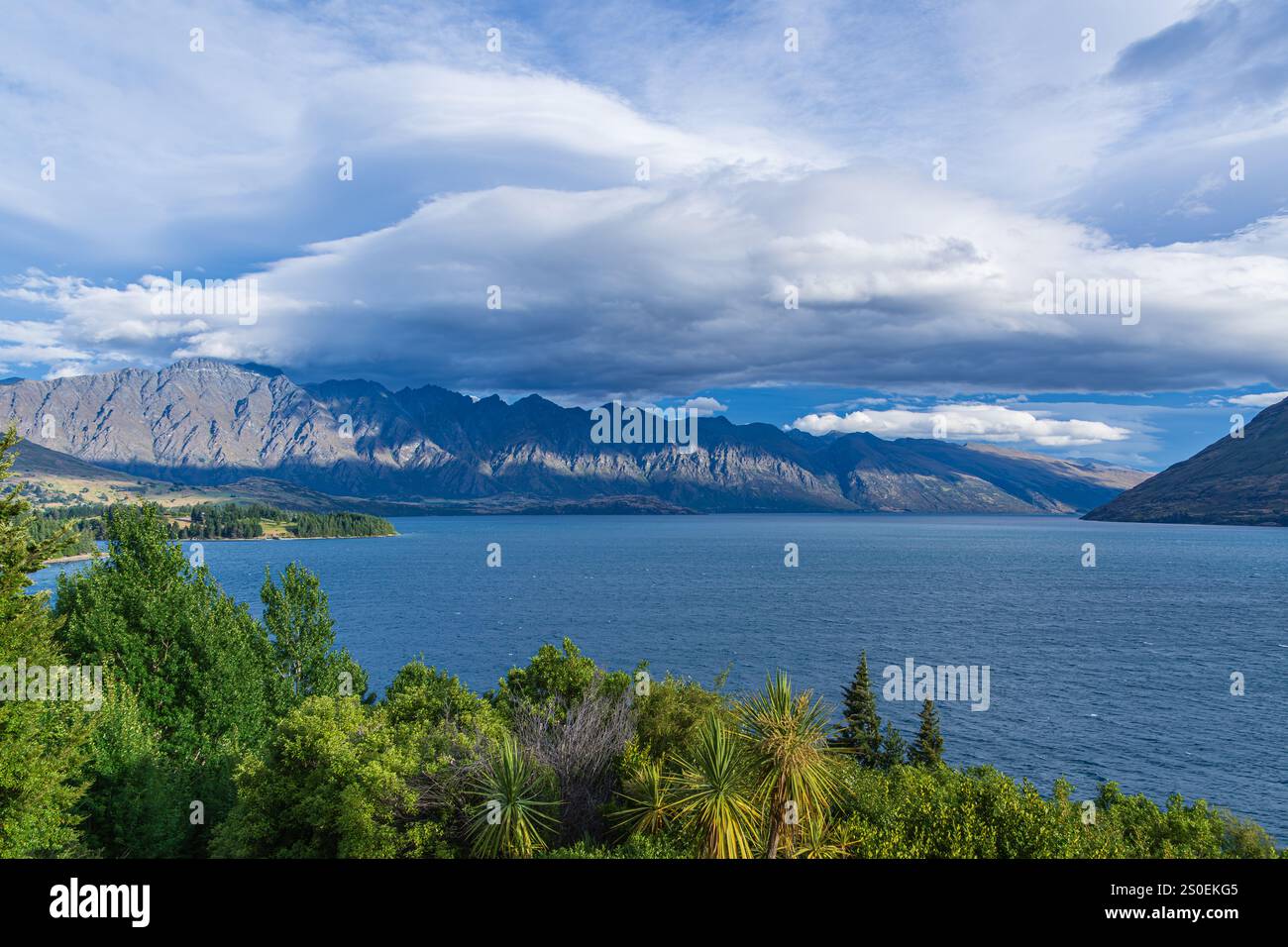 Lake Wakatipu, where the mountains run straight into the lake, is a ...