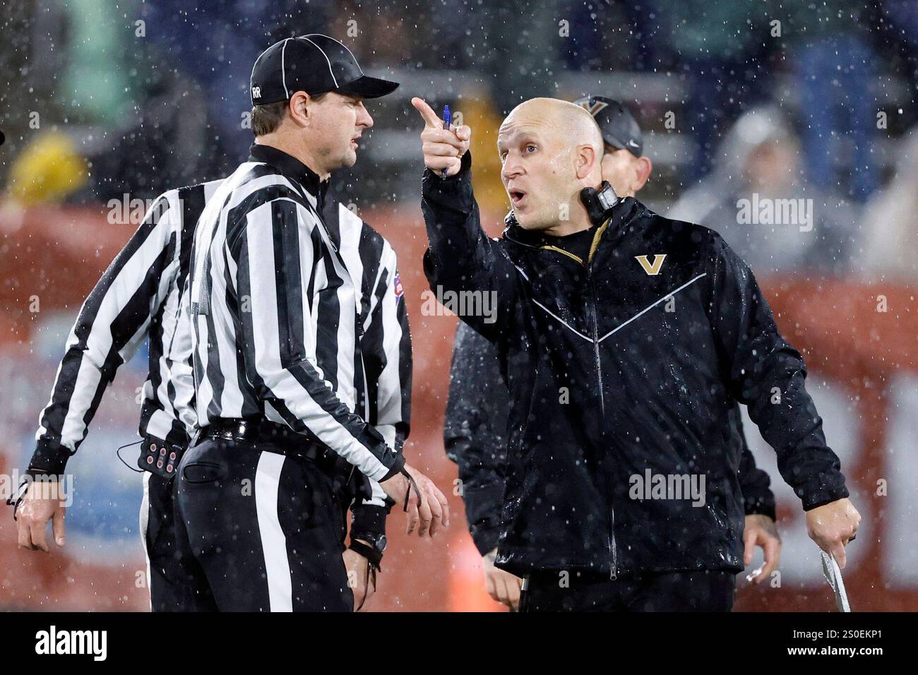 Vanderbilt head coach Clark Lea talks with a referee about a play ...