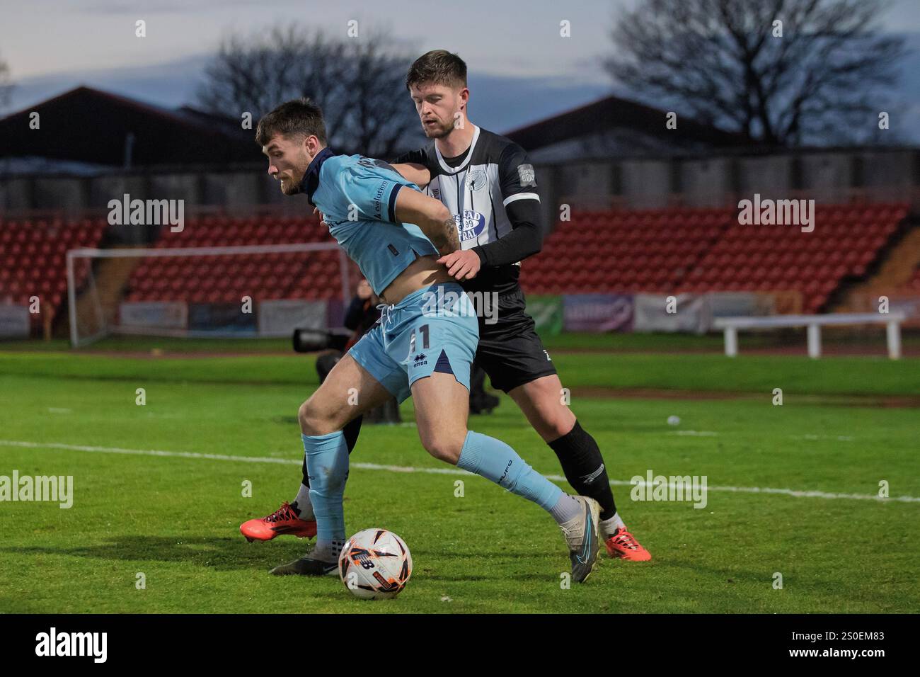 Hartlepool United's Luke Charman battles with Gateshead's Joe Grayson ...