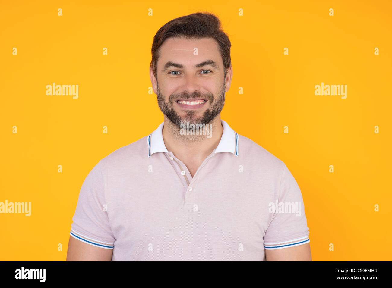Smiling male model isolated on studio background. Positive man in good ...