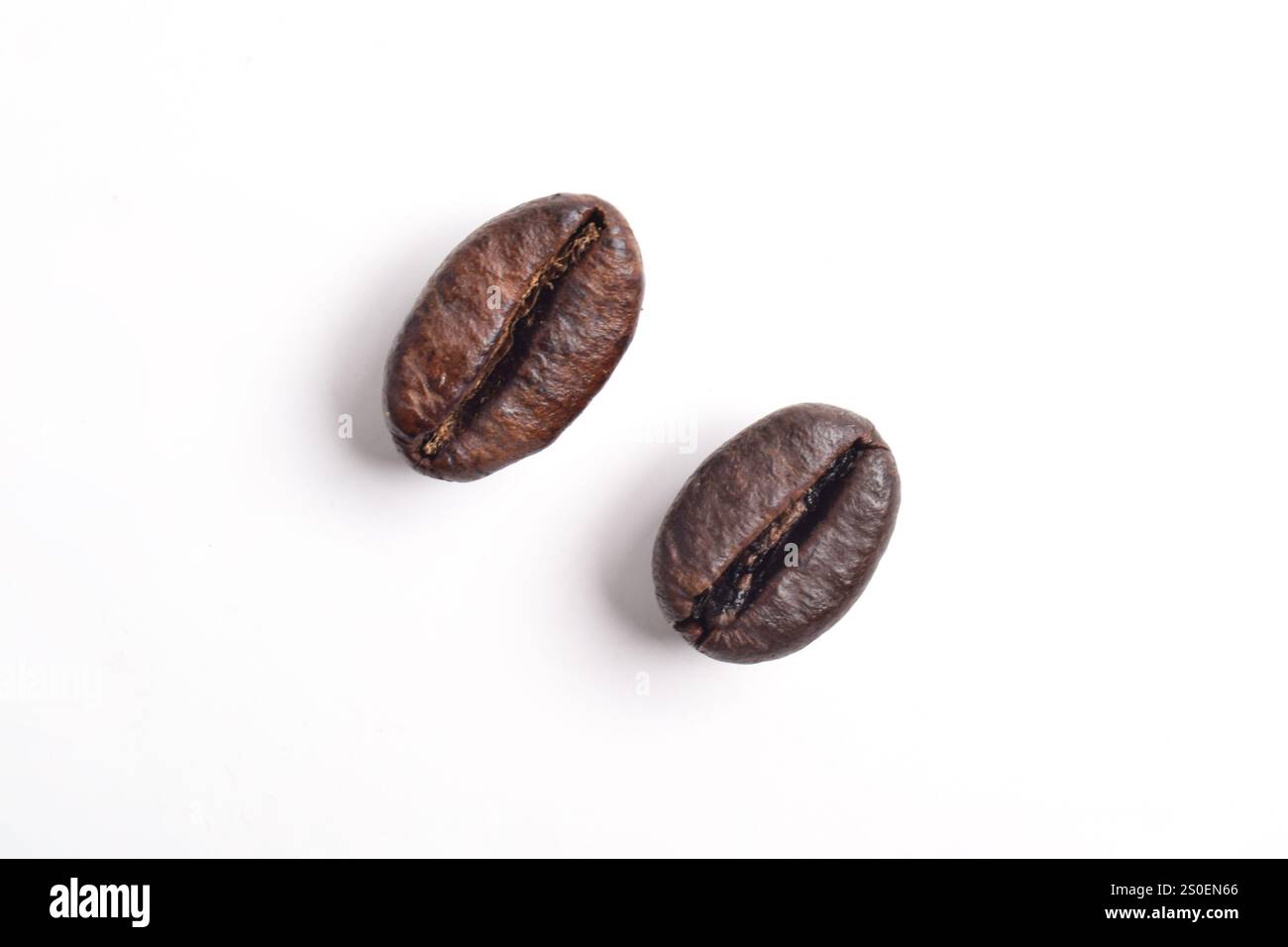 Two coffee beans isolated on white background Stock Photo - Alamy