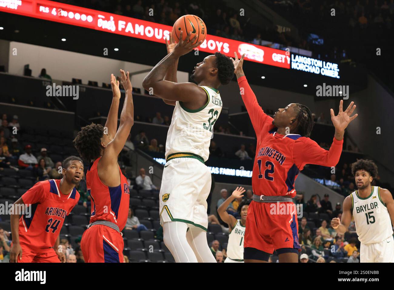 Baylor guard Jalen Celestine, center, shoots over Arlington Baptist ...