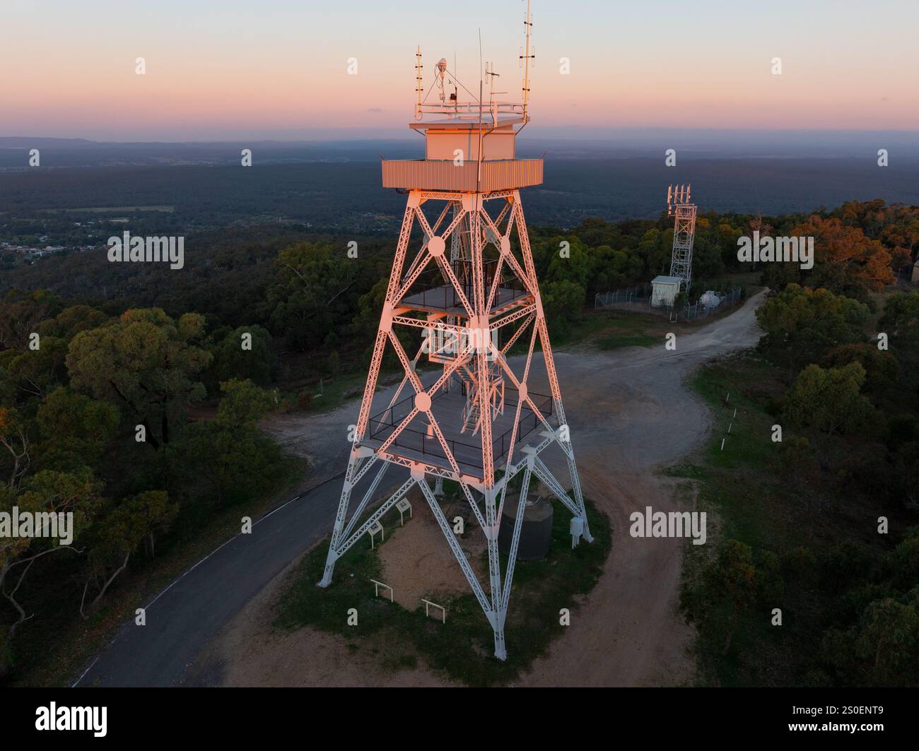Aerial view of lookout tower ona hilltop during twilight at Maldon in ...