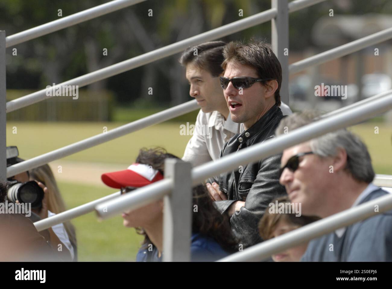 Tom Cruise attends a public event, sporting a black leather jacket and ...