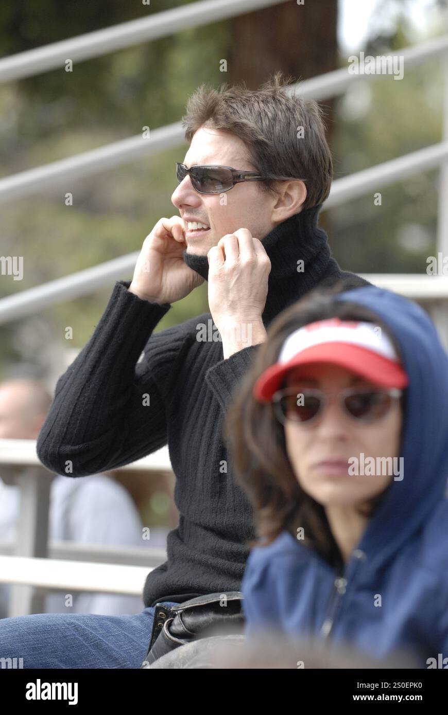 Tom Cruise attends a public event, sporting a black leather jacket and ...