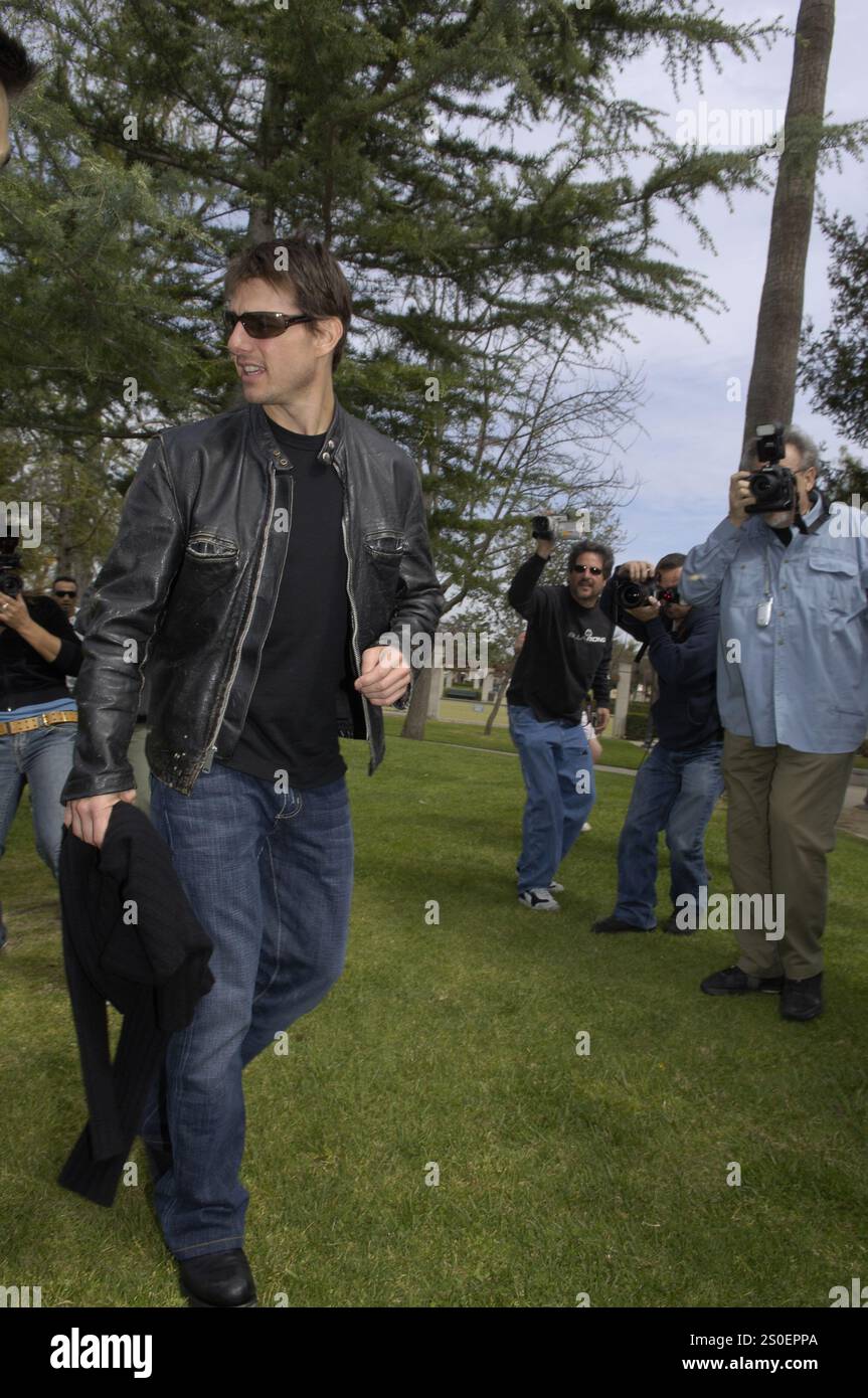 Tom Cruise attends a public event, sporting a black leather jacket and ...