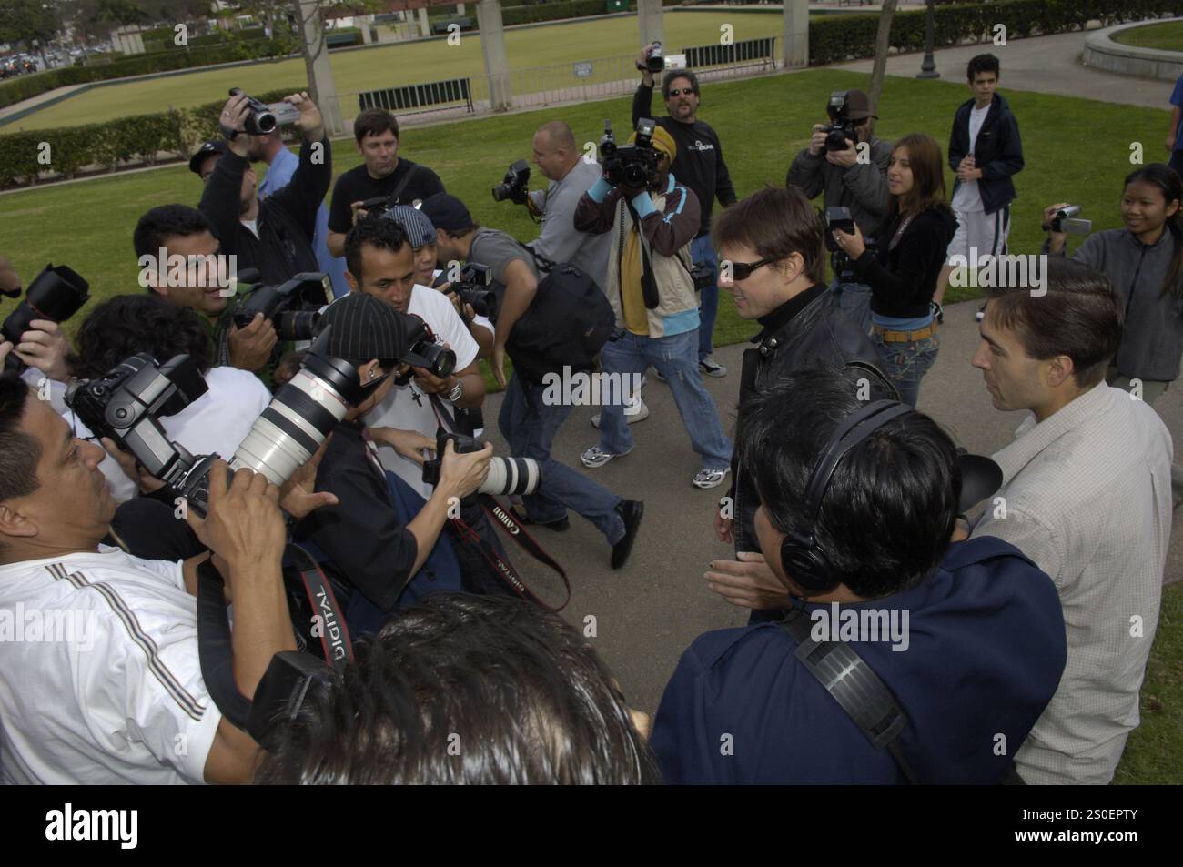 Tom Cruise attends a public event, sporting a black leather jacket and ...