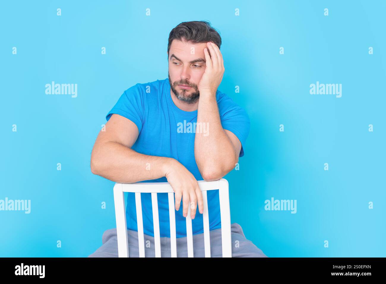 Stressed lonely man holding his head, feeling anxious. Man experiencing ...