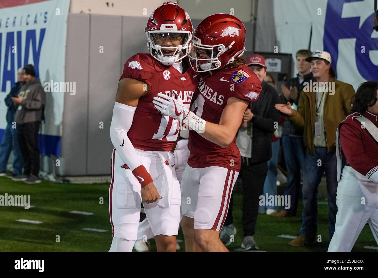 Arkansas quarterback Taylen Green, left, celebrates his touchdown with ...
