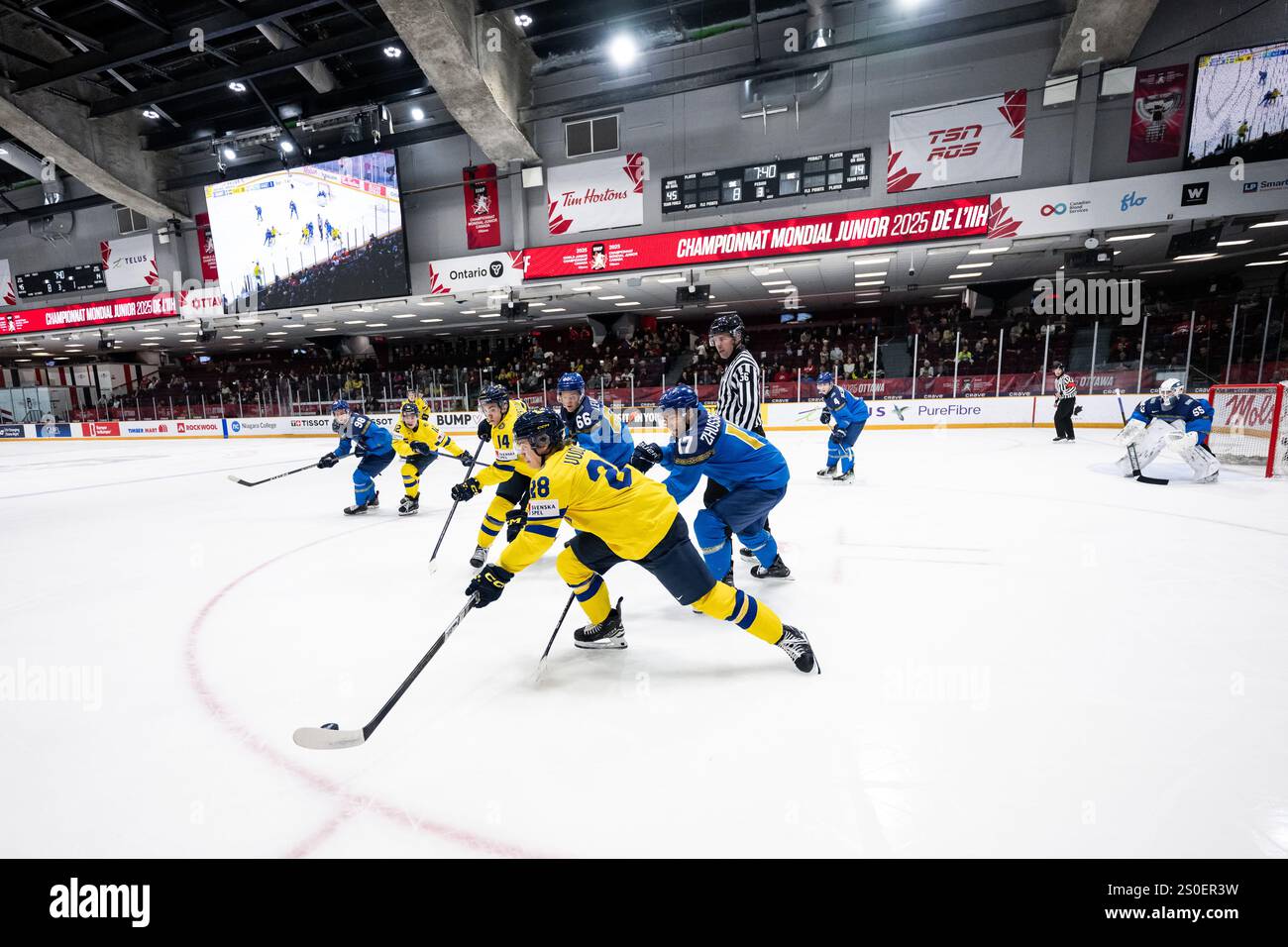 Linus Eriksson and Oskar Voullet of, Sweden. , . compete for the puck ...