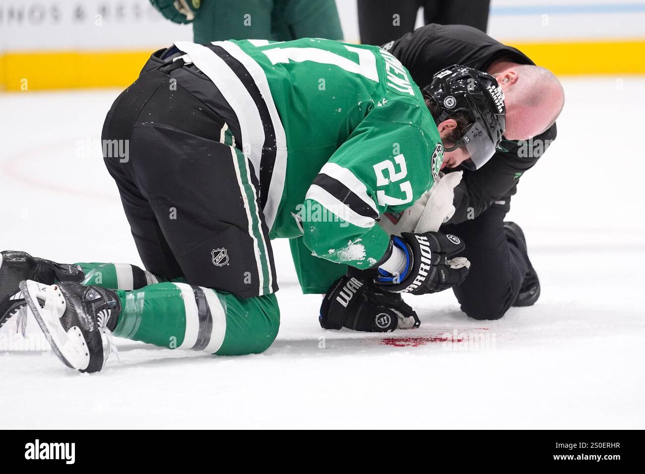 Dallas Stars left wing Mason Marchment (27) is tended to after he was ...