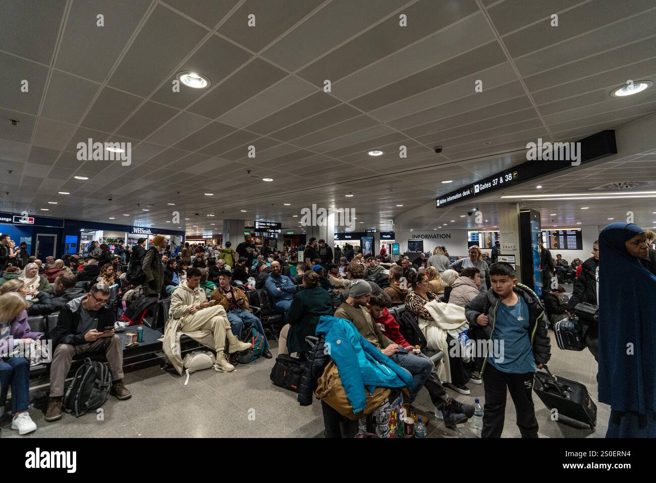 Manchester, UK. 27th Dec, 2024. Passengers in the Manchester Airports ...