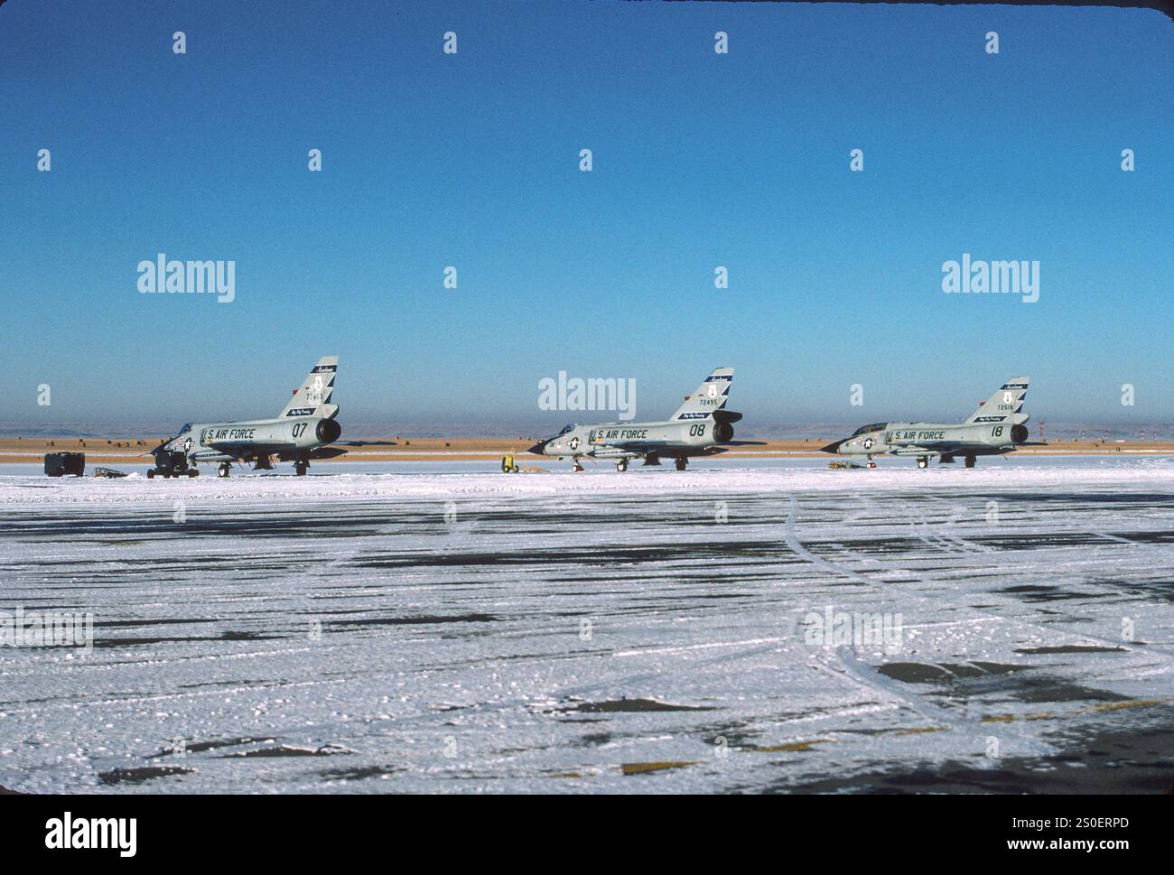 Three Montana ANG F-106s on a snow covered ramp, December 1986. This ...