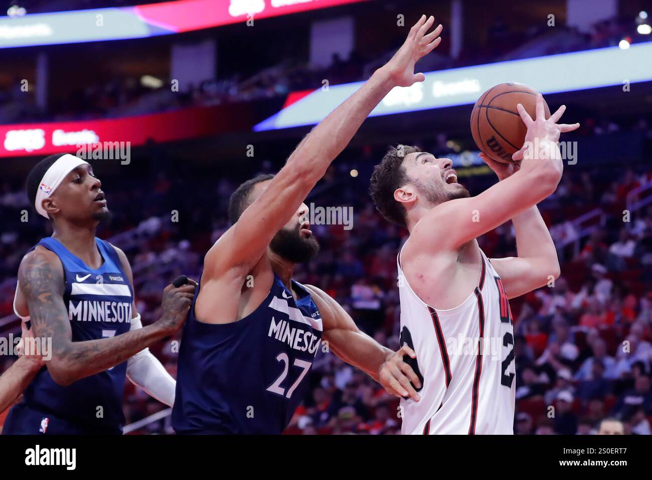 Houston Rockets center Alperen Sengun, right, puts up a shot in front ...