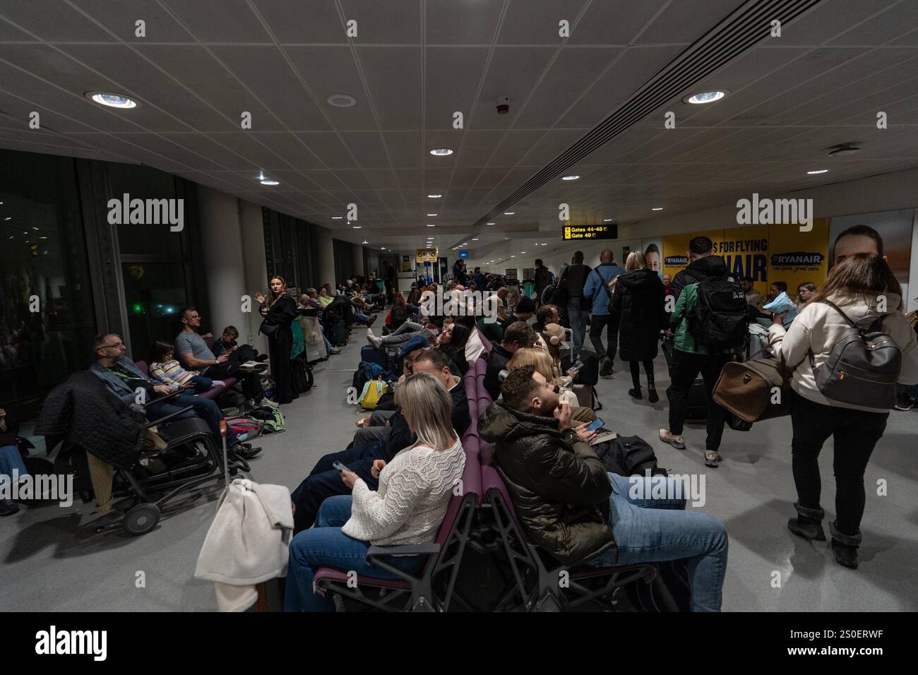 Manchester, UK. 27th Dec, 2024. Passengers in the Manchester Airports ...
