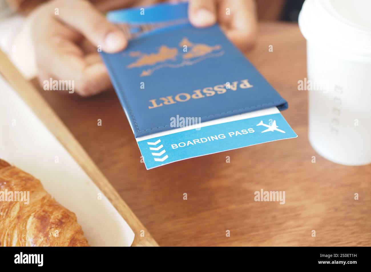hand holding Airline Boarding Passes and passport Stock Photo - Alamy