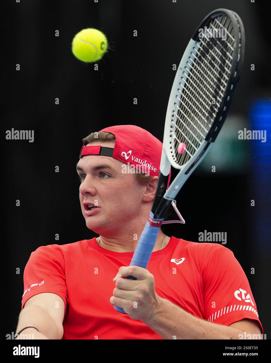 Switzerland's Dominic Stricker plays a forehand return to France's Ugo ...